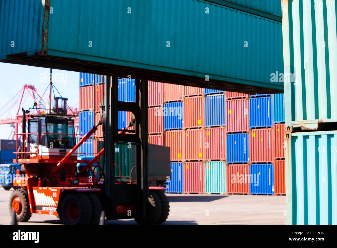 Truck lifting cargo containers Stock Photo - Alamy