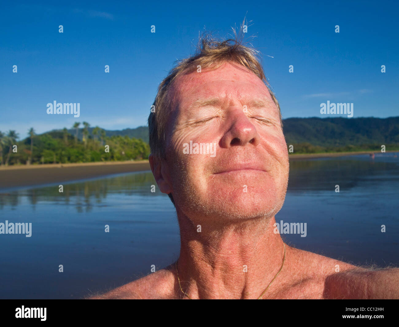 A middle aged man taking the sun in Costa Rica Stock Photo - Alamy