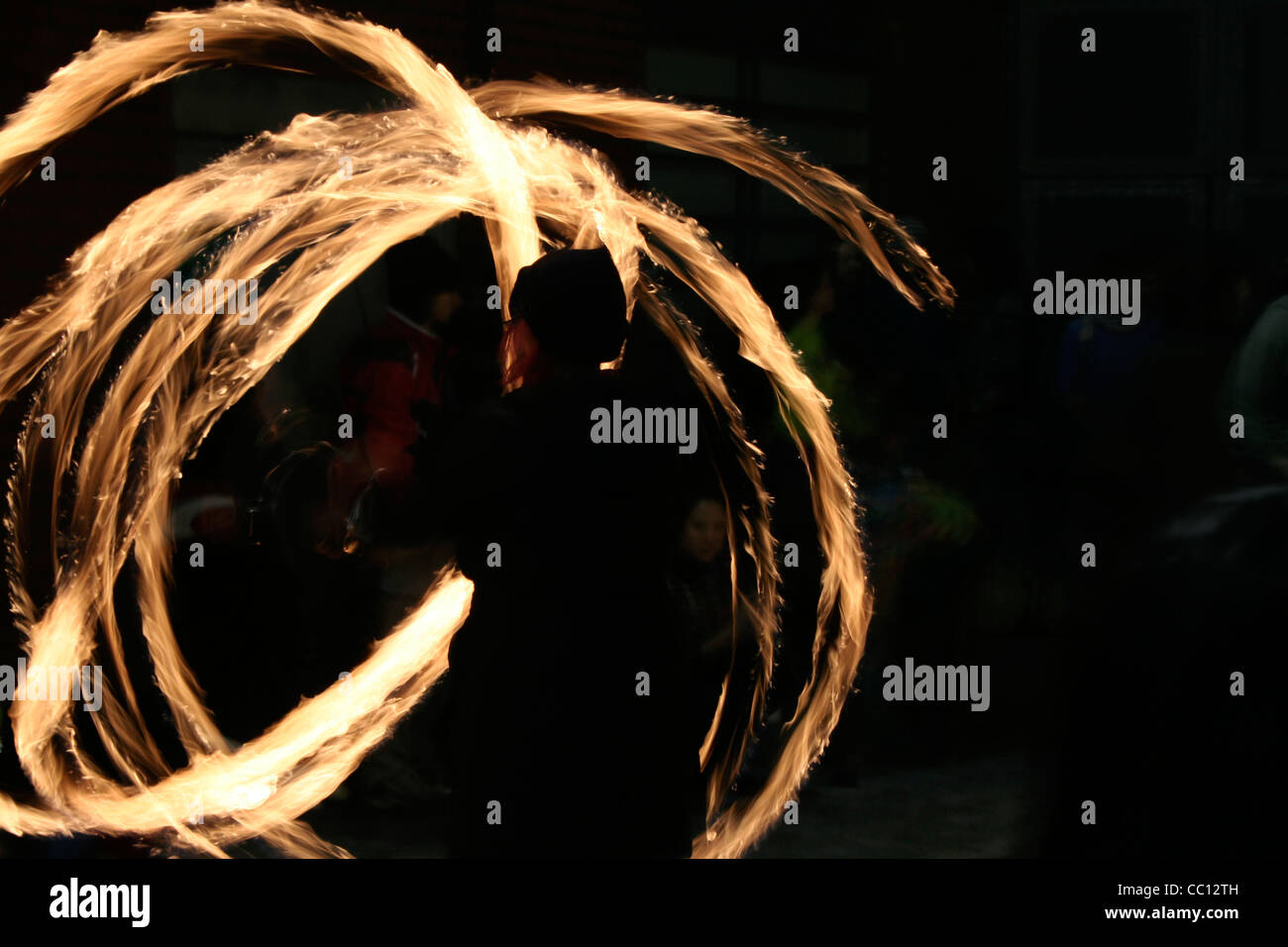 Fire poi spinning at night Stock Photo - Alamy