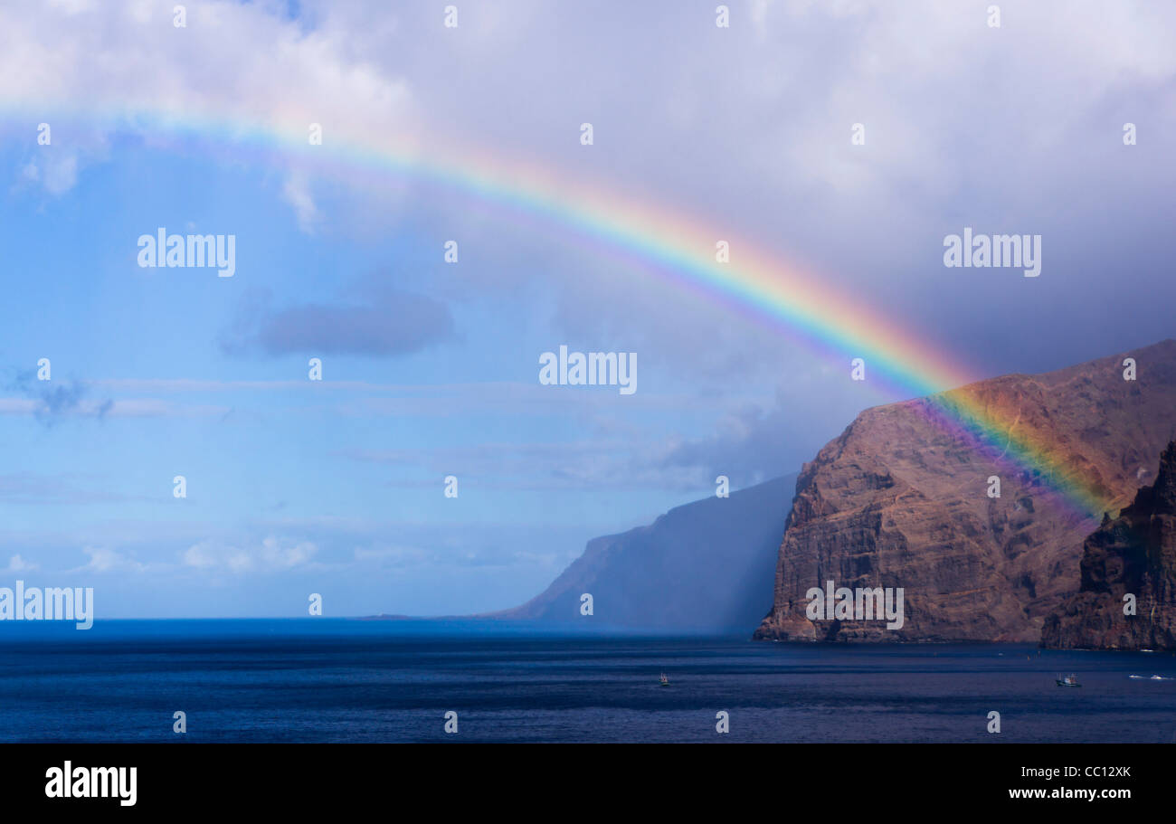 Los Gigantes, Tenerife. Rainbow from Masca Bay over the ocean Stock ...