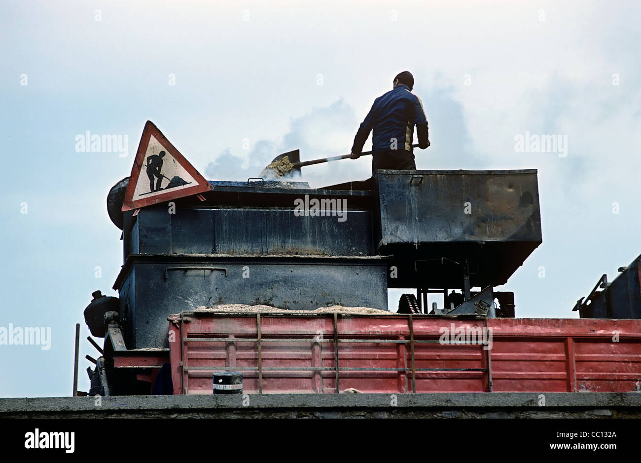 Man On Road Works With "Man At Work" Sign Stock Photo - Alamy