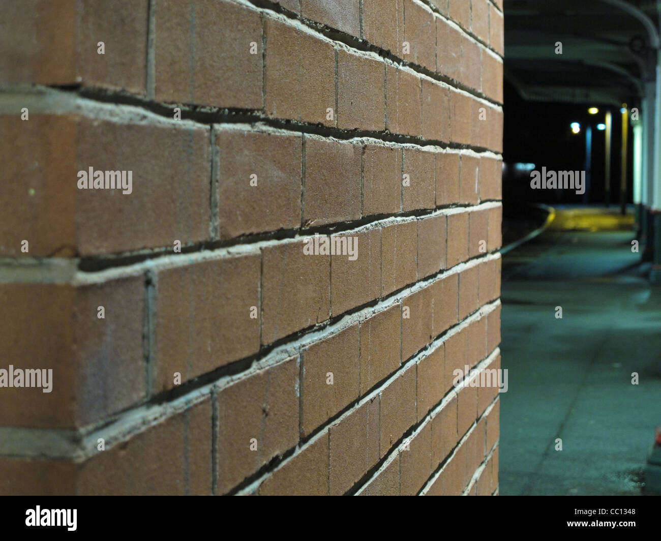 brick wall in train rail railway station platform in great britain uk ...
