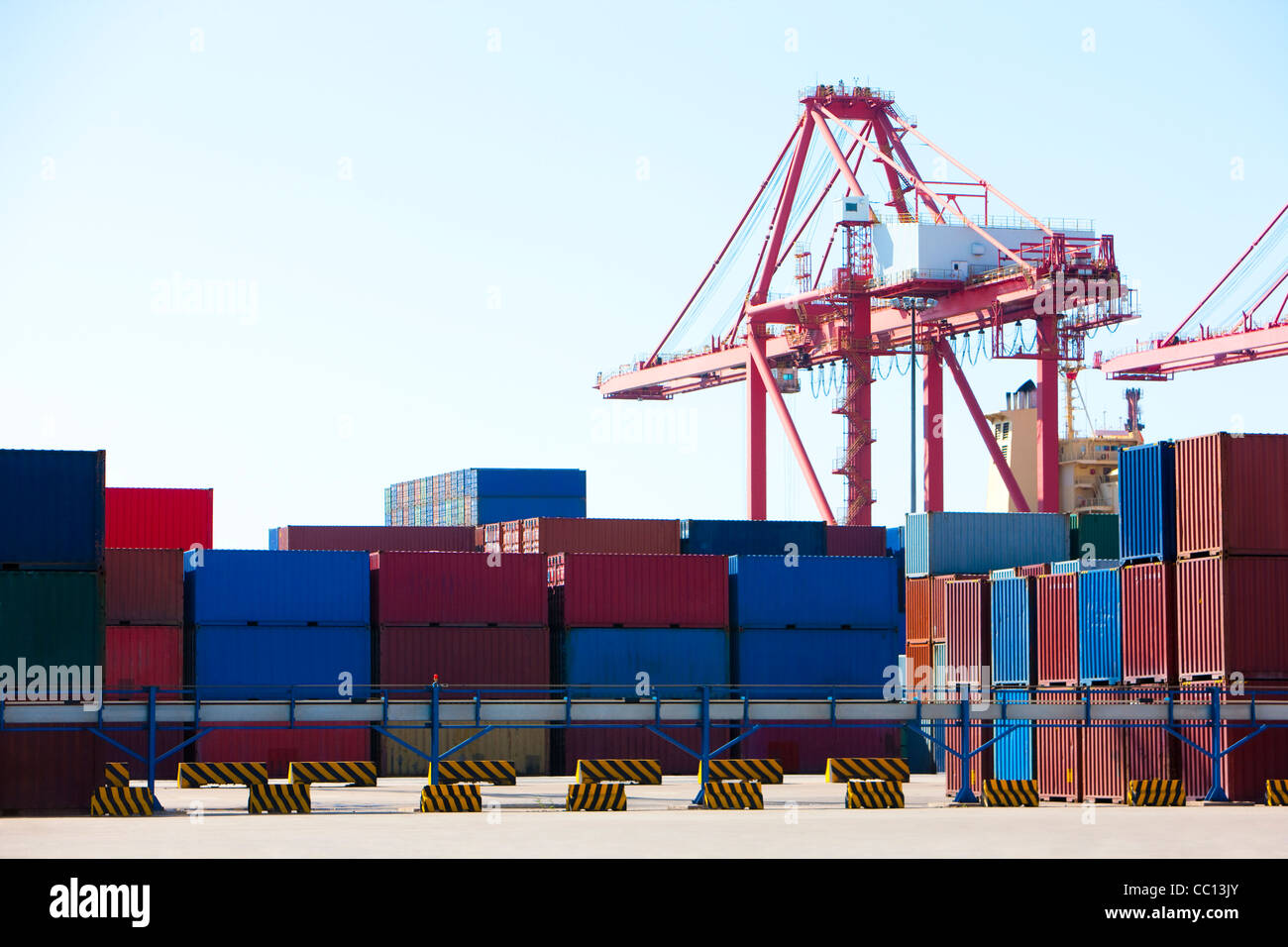 Cranes and cargo containers in shipping dock Stock Photo - Alamy