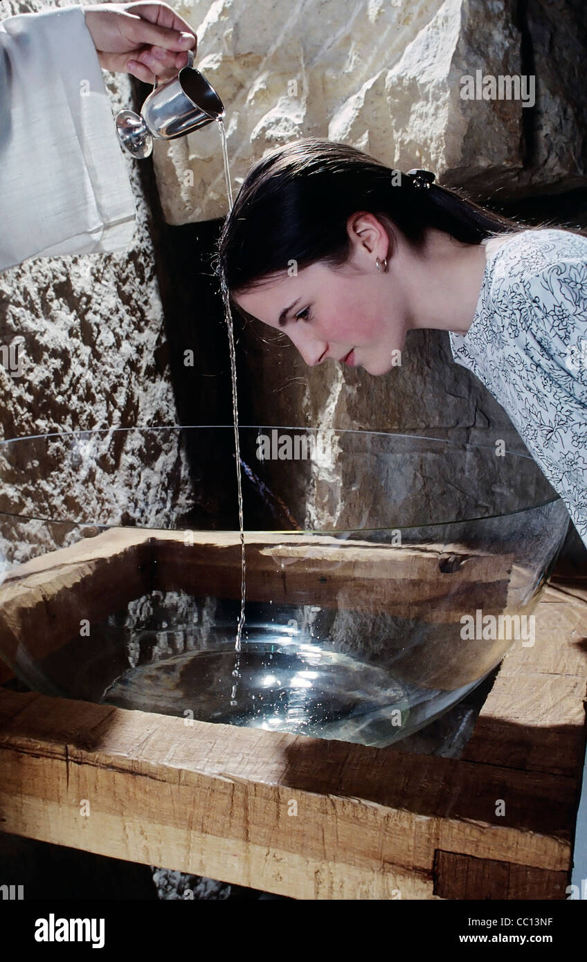 Christian baptism Sacrament of a girl - anointing the supplicant’s head ...