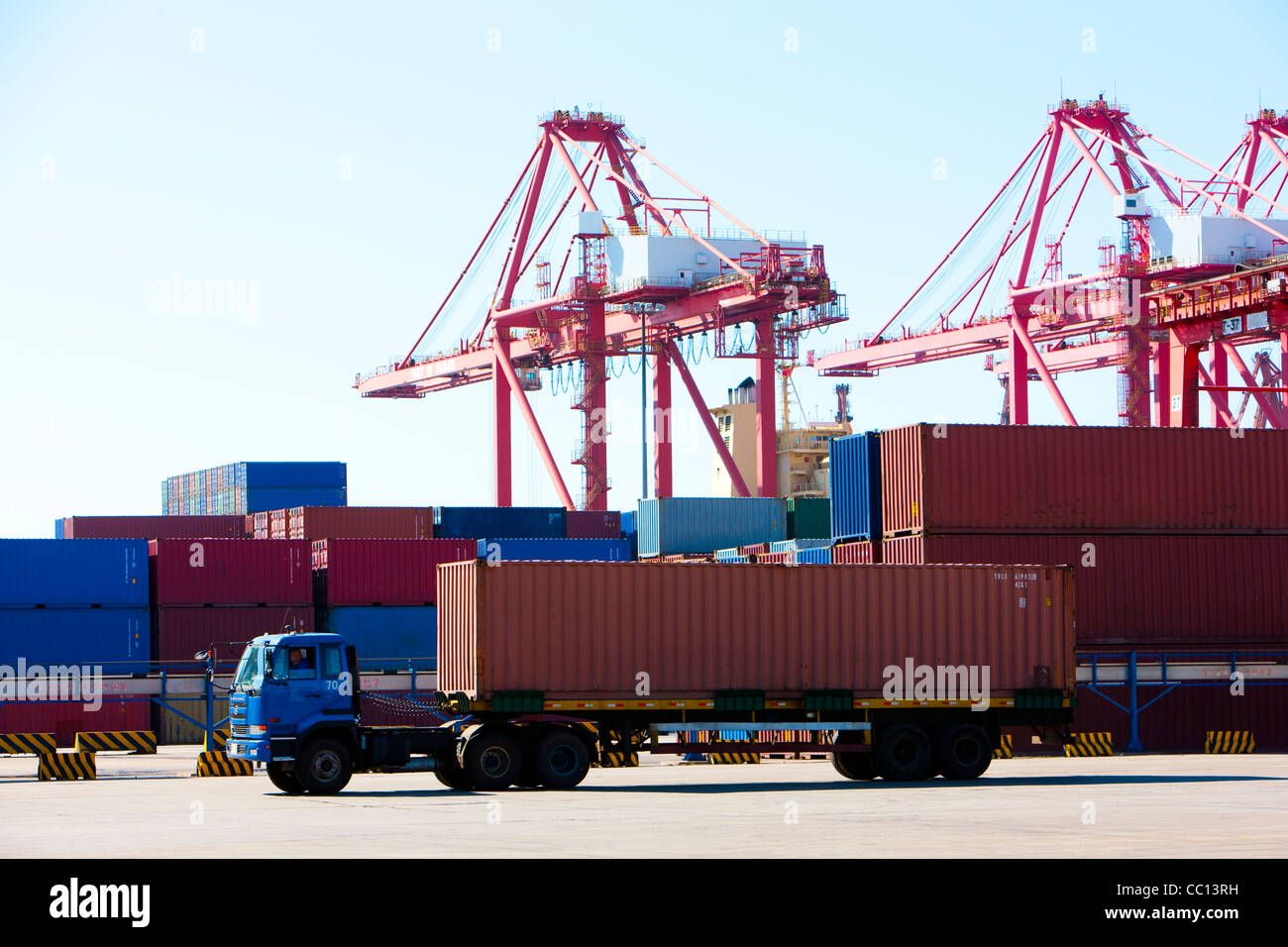 Cranes and cargo containers in shipping dock Stock Photo - Alamy