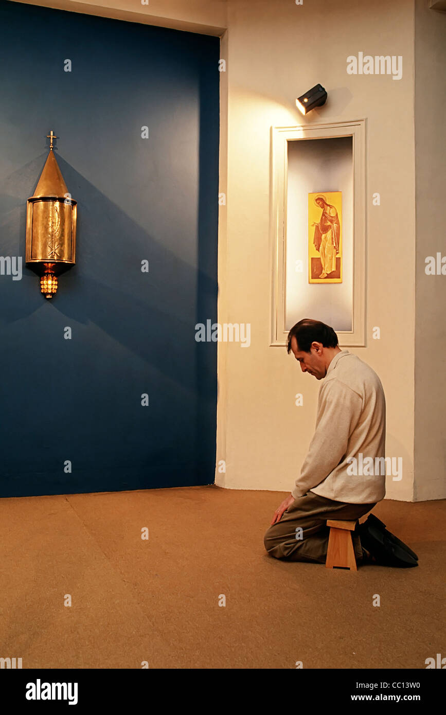 Man Praying in Chapel Stock Photo - Alamy
