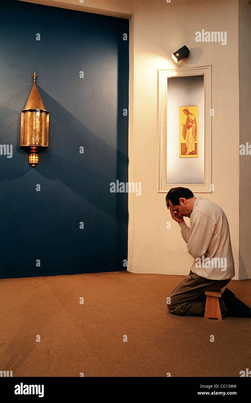 Man Praying in Chapel Stock Photo - Alamy