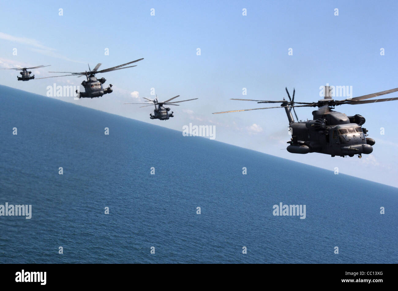 A five-ship formation of MH-53 Pave Low helicopters flies June 12 over ...