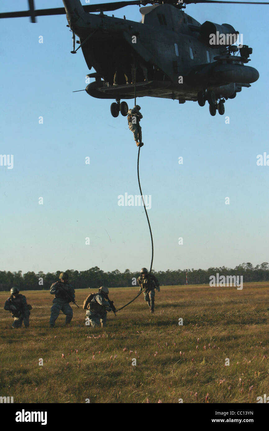 Green Berets practice "fast-roping" from the tail of an Air Force MH-53 ...