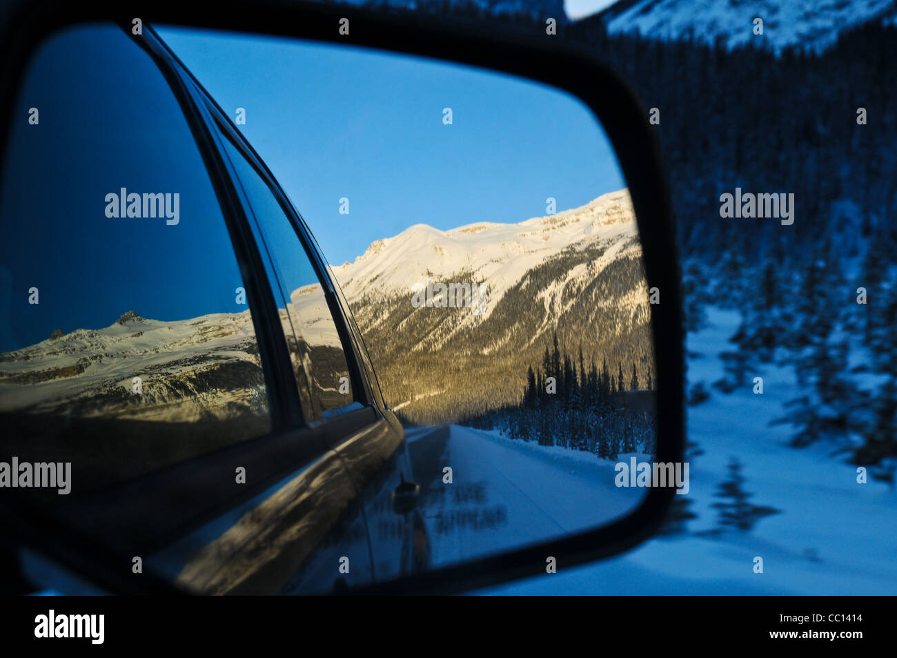 Winter landscape seen through a car mirror Stock Photo - Alamy