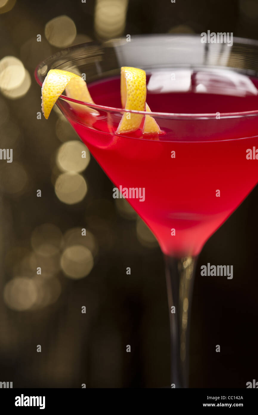 Cosmopolitan cocktail with lemon garnish Stock Photo - Alamy