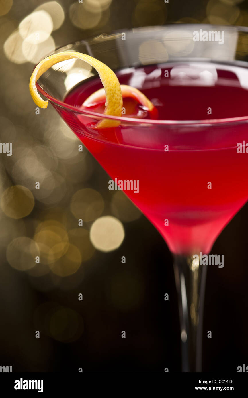 Cosmopolitan cocktail with lemon garnish Stock Photo - Alamy