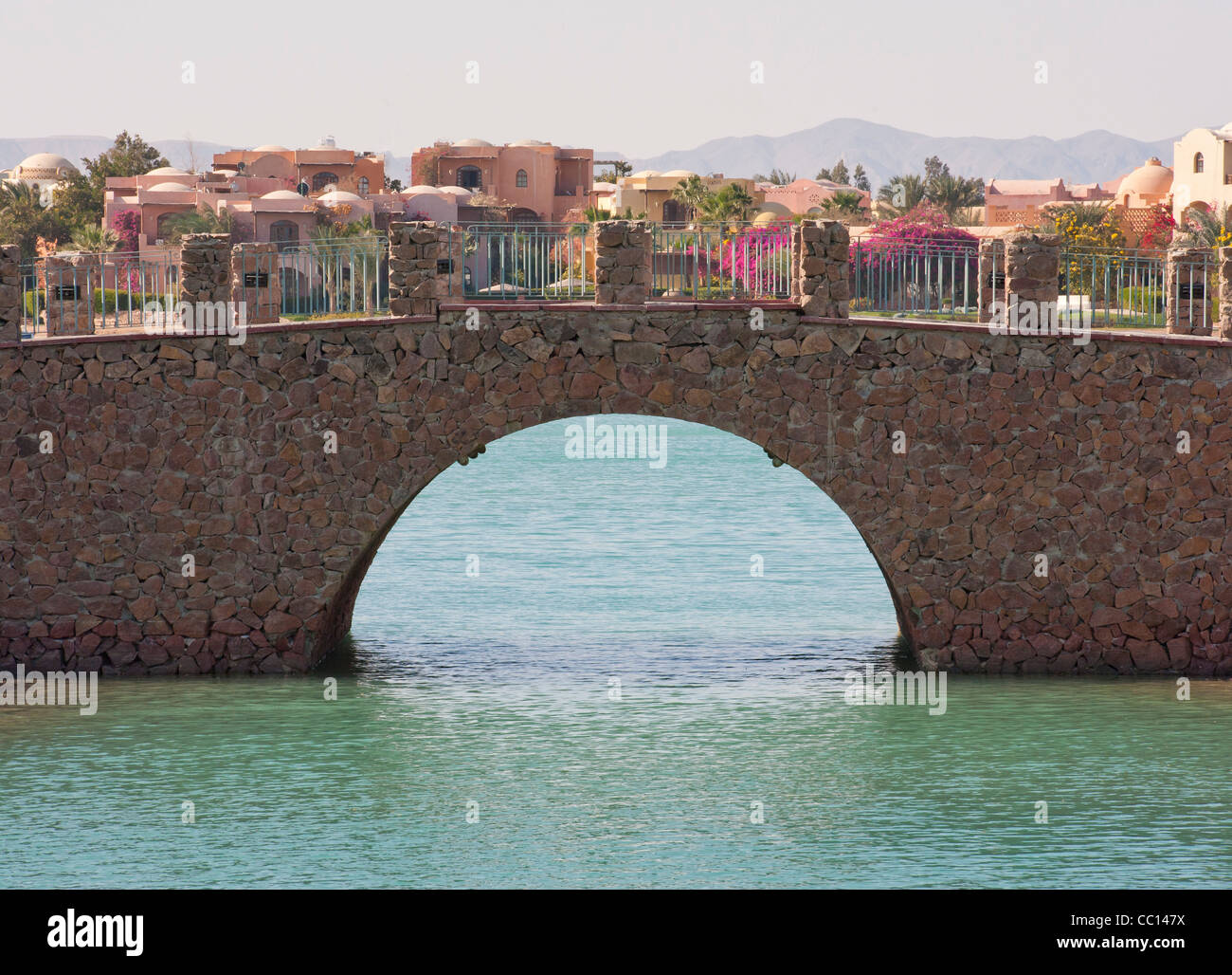 Stone bridge over a river in tropical resort Stock Photo - Alamy