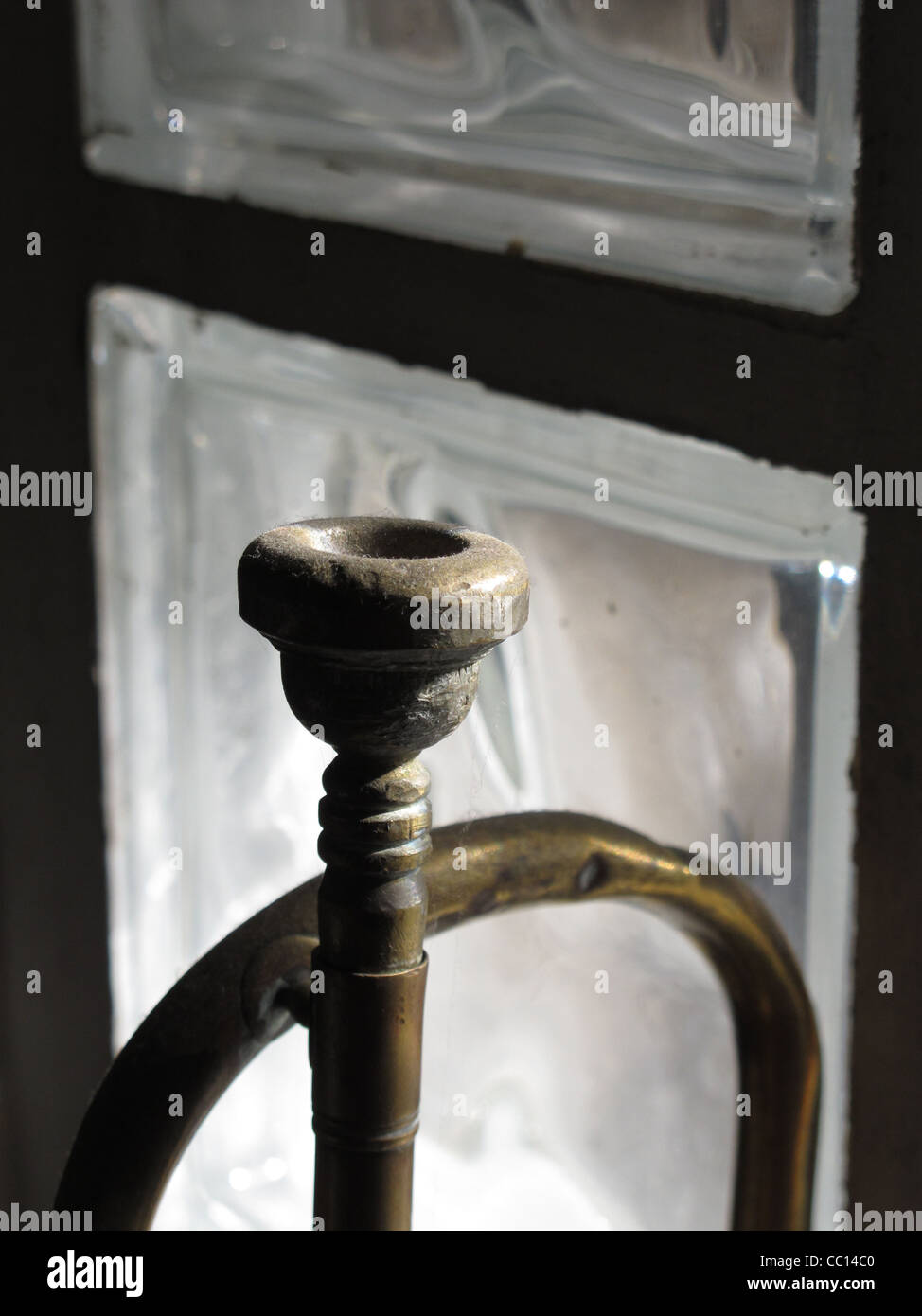 old brass horn trumpet music instrument by window Stock Photo - Alamy