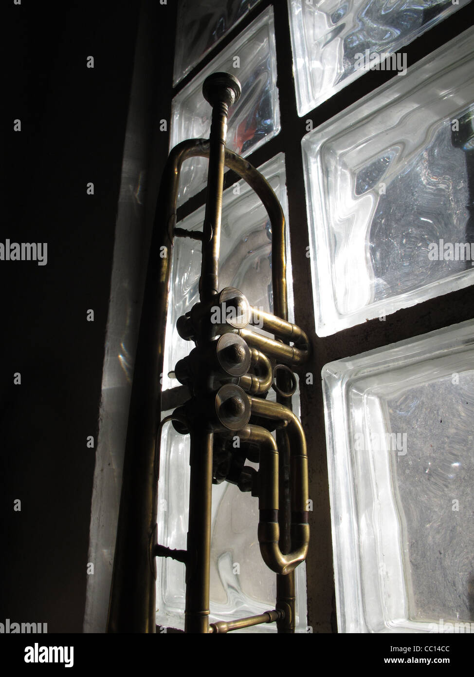 old brass horn trumpet music instrument by window Stock Photo - Alamy