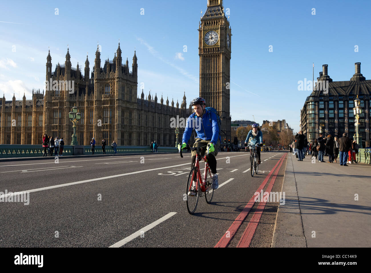 cyclists crossing westminster bridge cycle lane outside the palace of ...