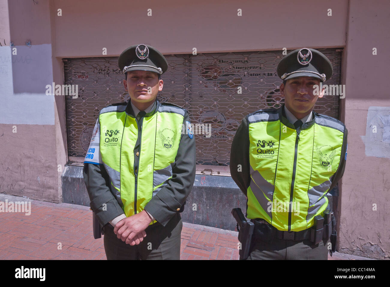 Two tourist police stand on the street in Quito, Ecuador in their ...