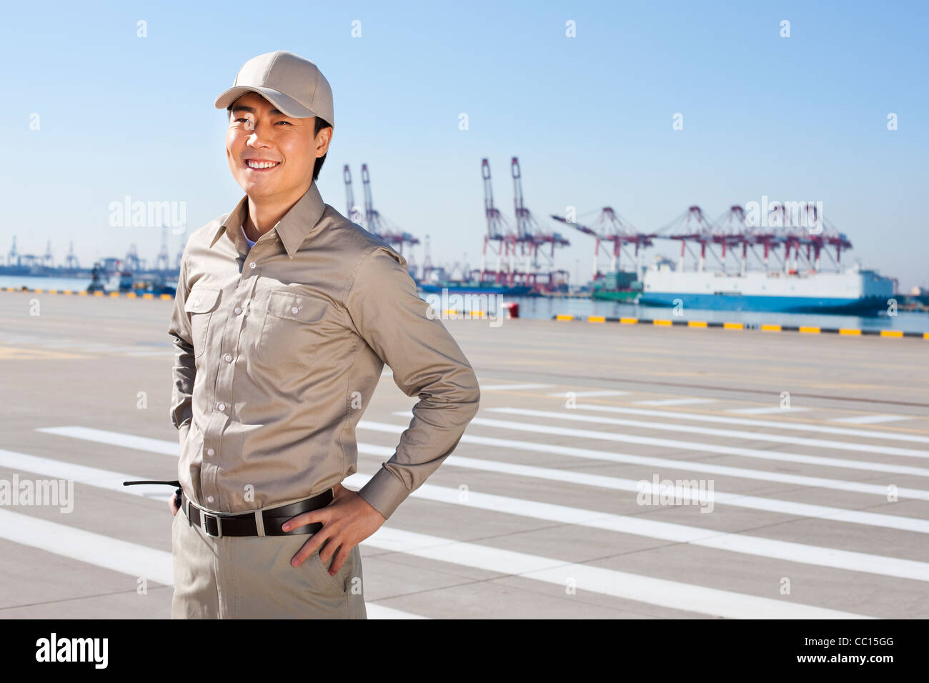 Male shipping industry worker with shipping dock background Stock Photo ...