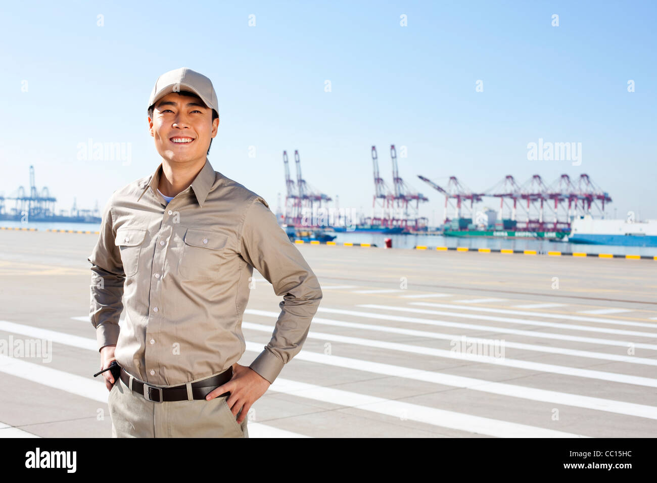 Male shipping industry worker with shipping dock background Stock Photo ...