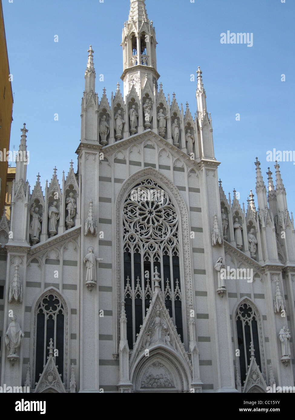 This white Gothic-style church features pointed arches, ribbed vaults ...