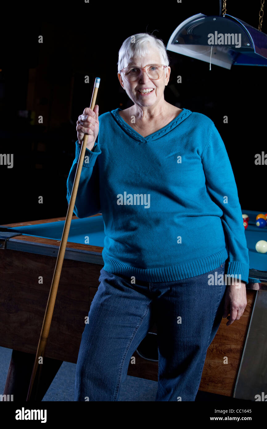Woman holding pool cue hi-res stock photography and images - Alamy