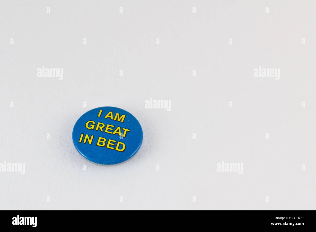 A button with a provocative slogan on white background Stock Photo - Alamy