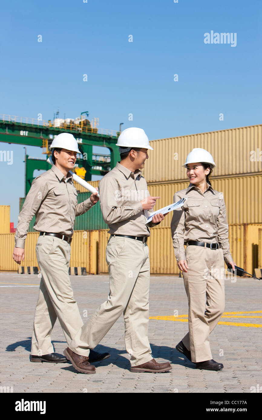 shipping industry workers talking Stock Photo - Alamy