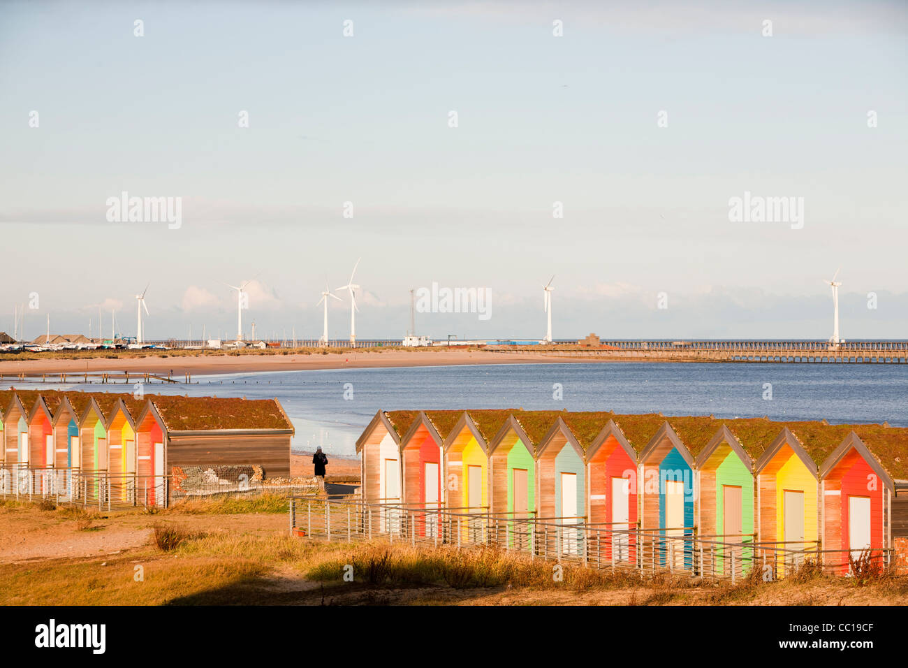 Colourful traditional British seaside beach huts on the beach in Blyth ...