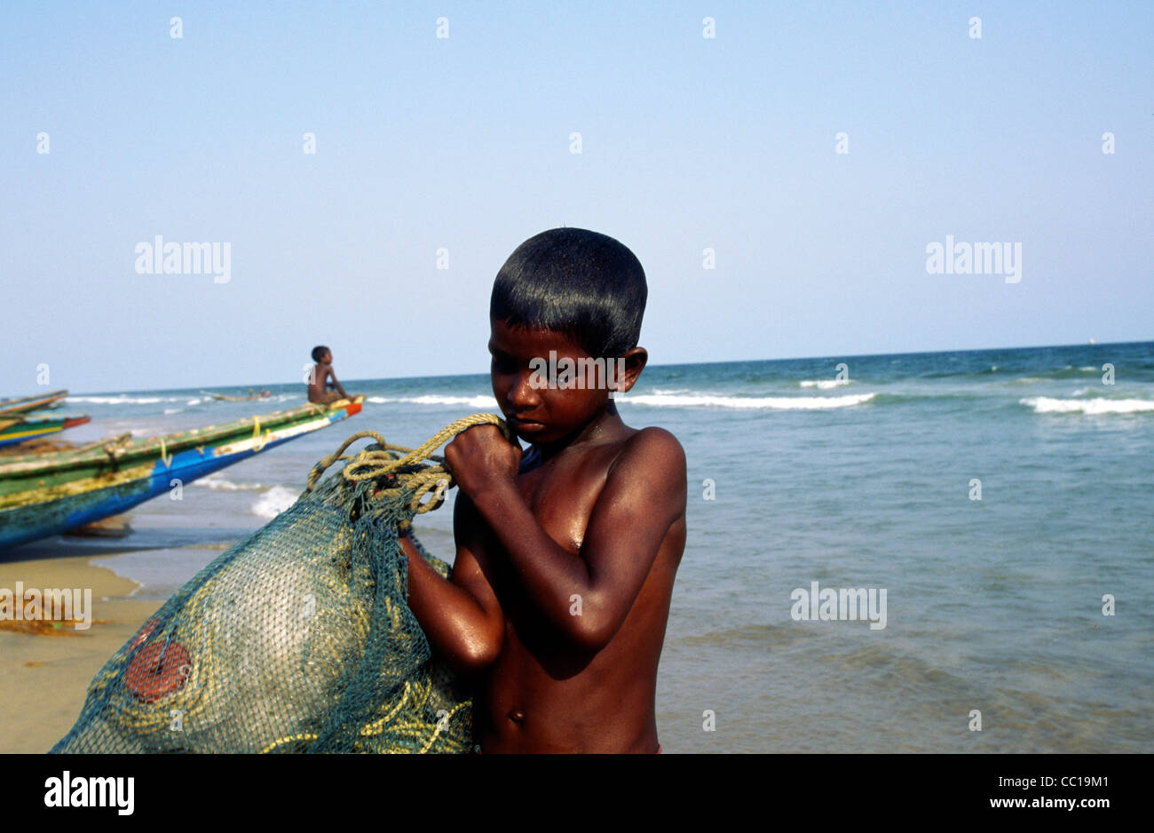 Child fishing labour hi-res stock photography and images - Alamy