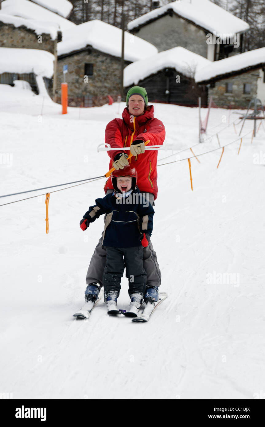 A lady and a boy on a drag lift Stock Photo - Alamy
