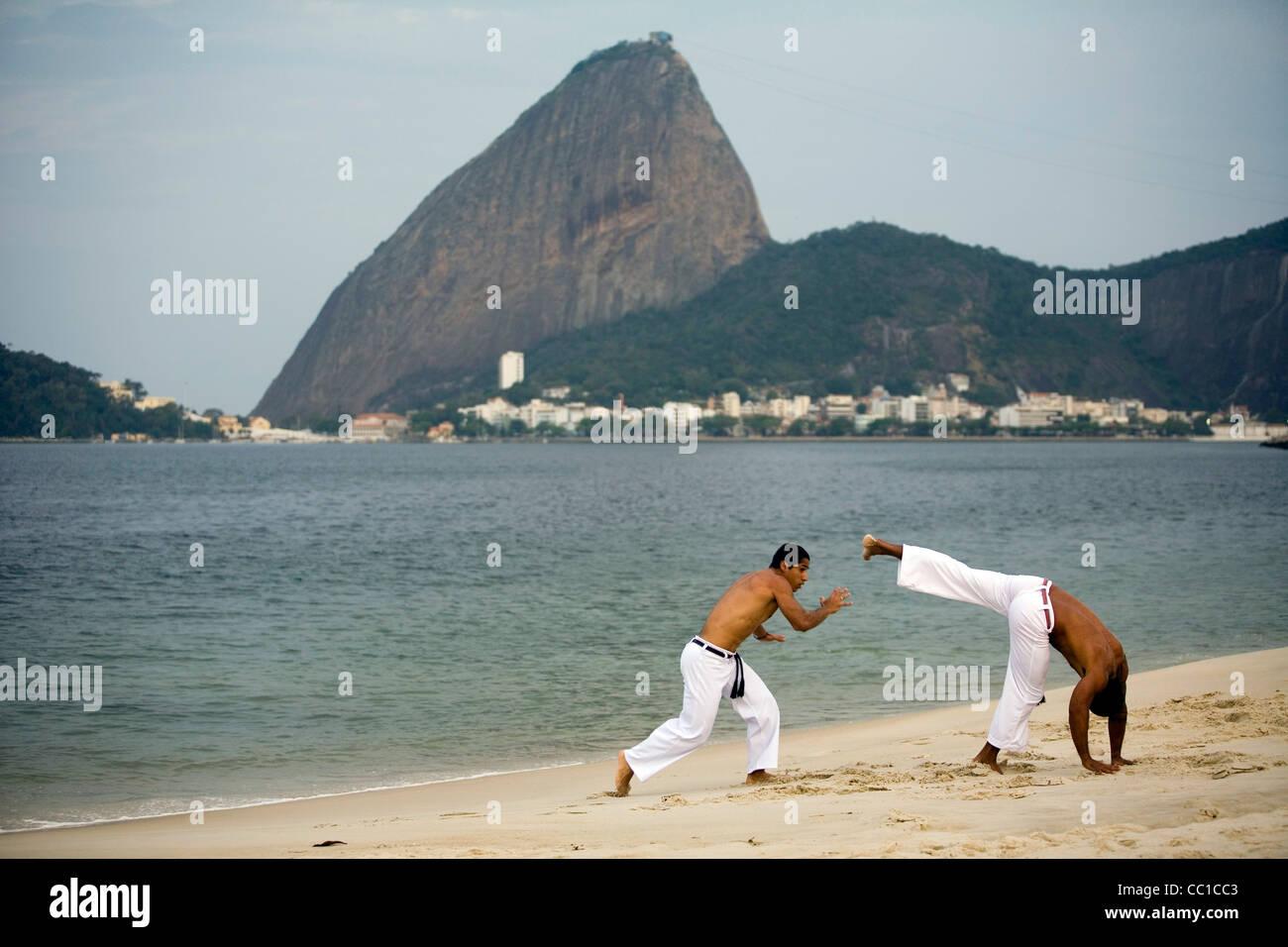 Capoeiristas practice Capoeira on Flamengo beach in Rio de Janeiro ...