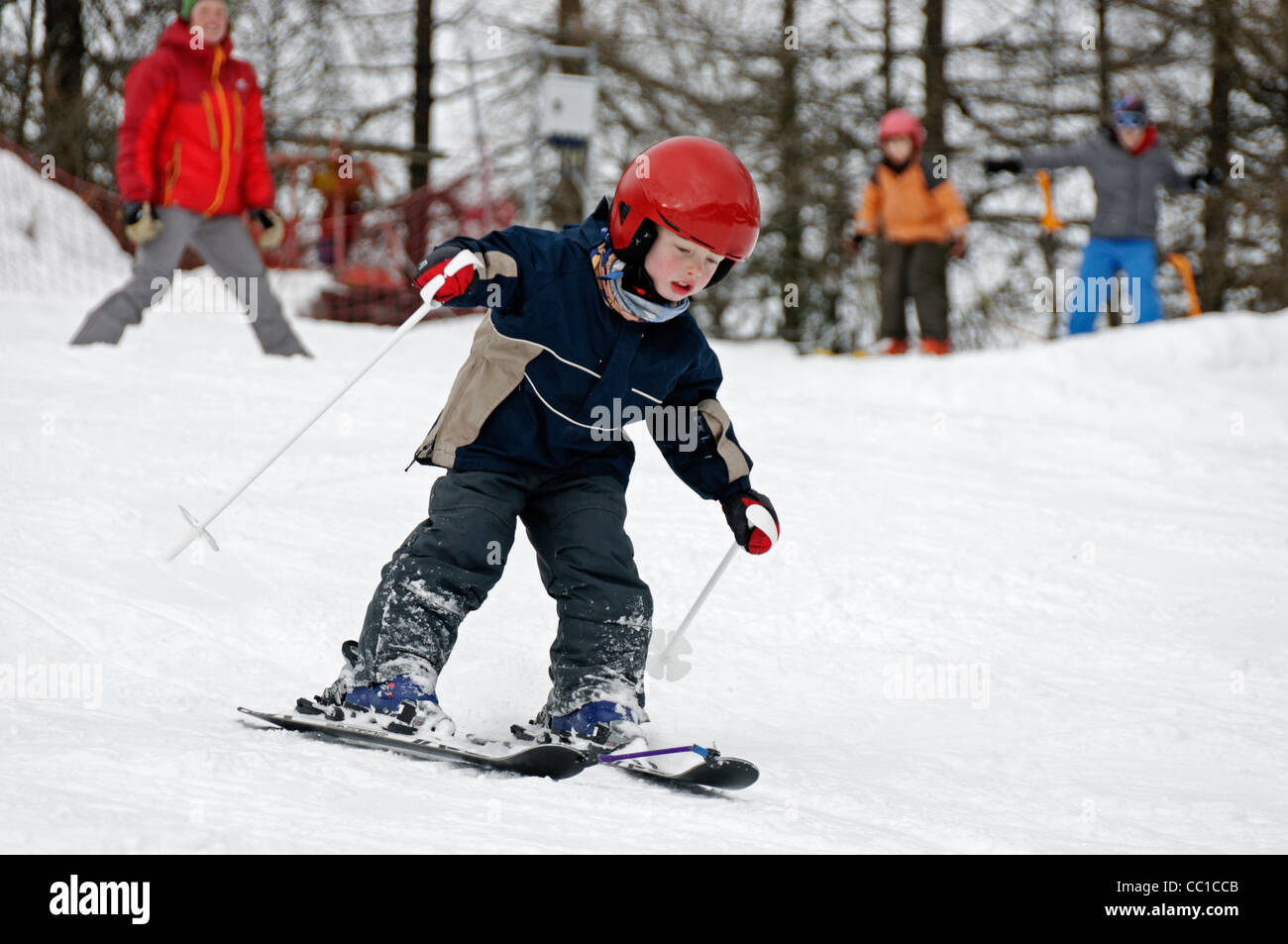 A young boy learning to ski Stock Photo - Alamy