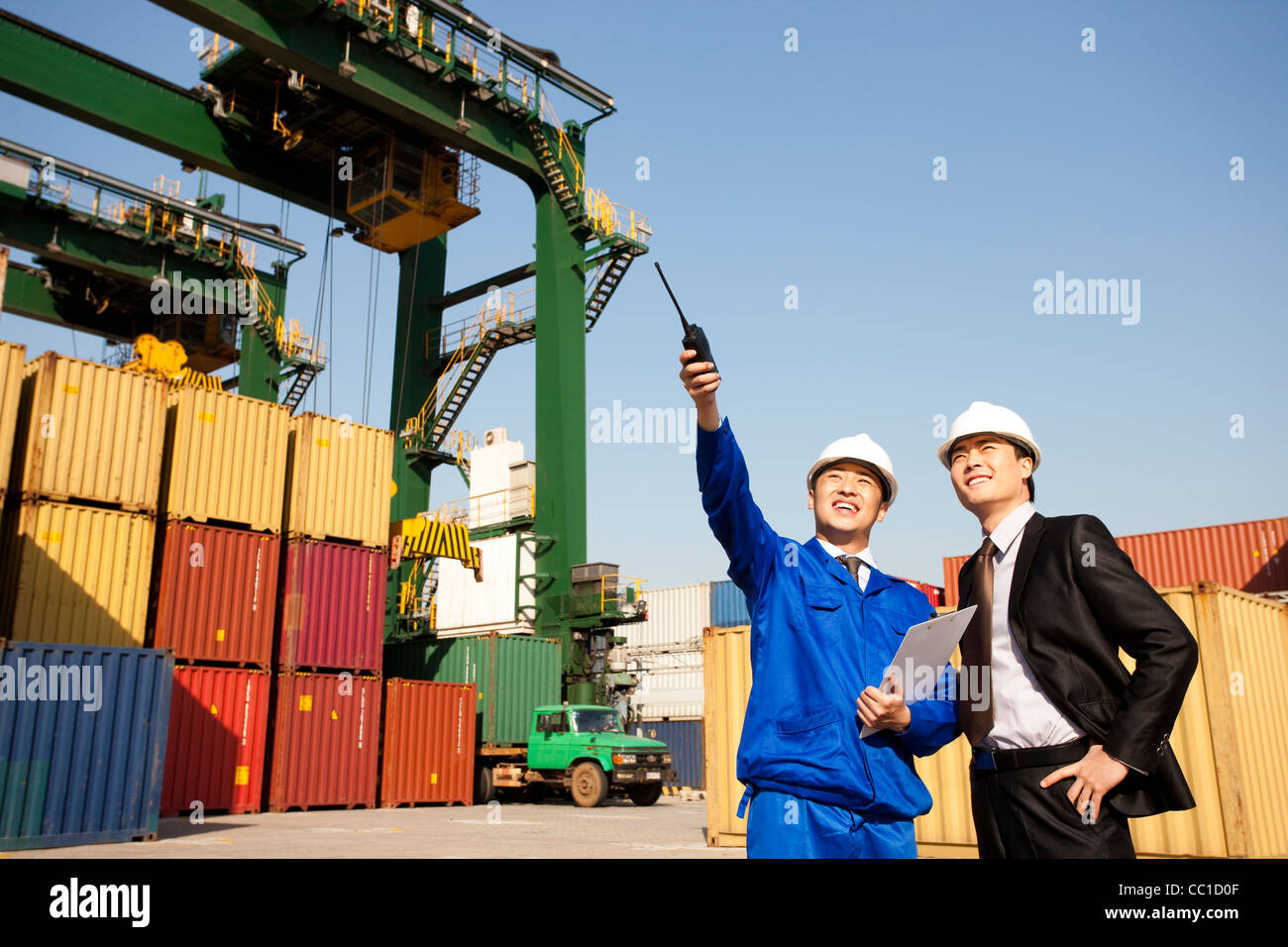 shipping industry manager pointing and a businessman looking Stock ...