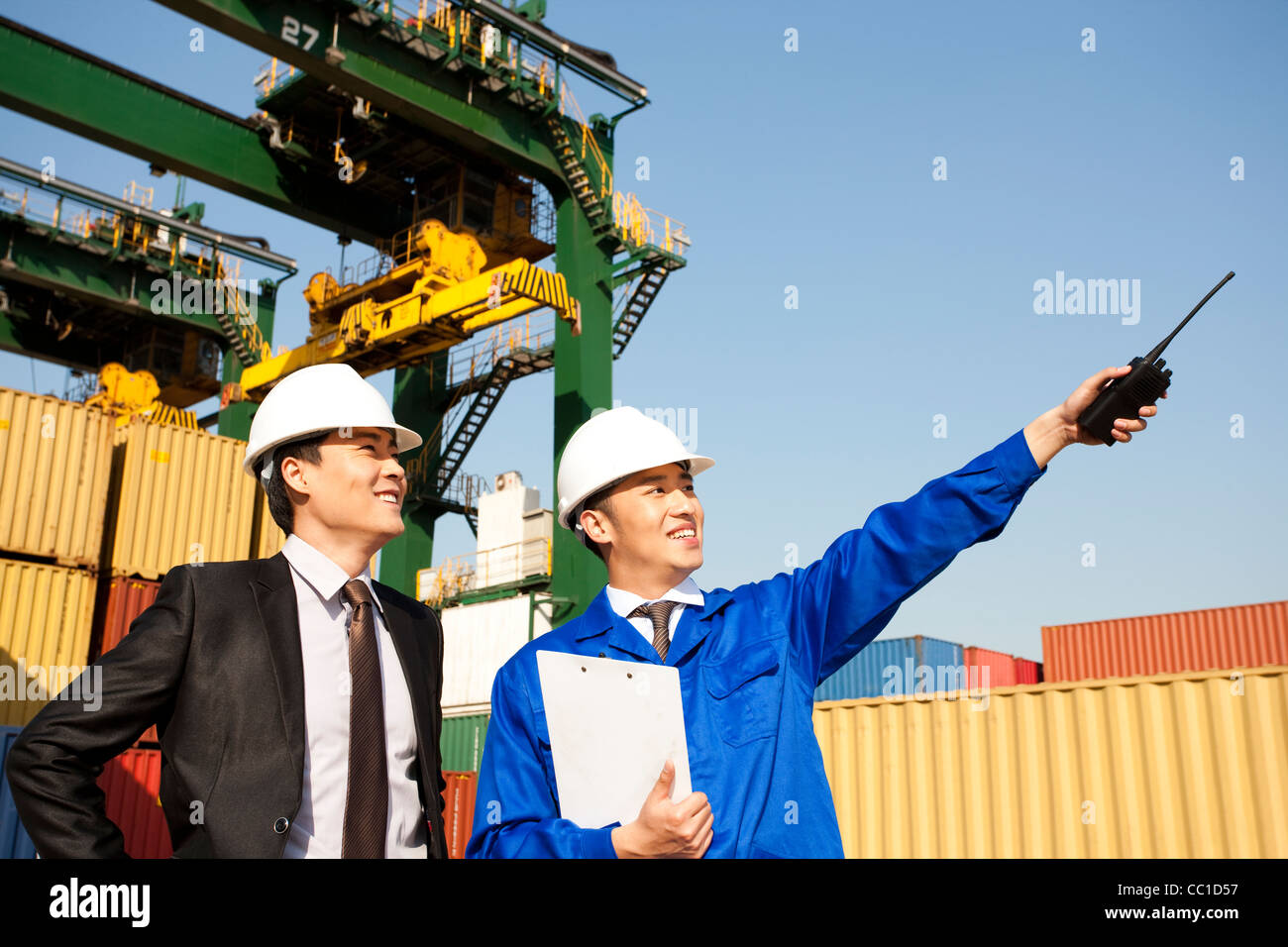 shipping industry manager pointing and a businessman looking Stock ...