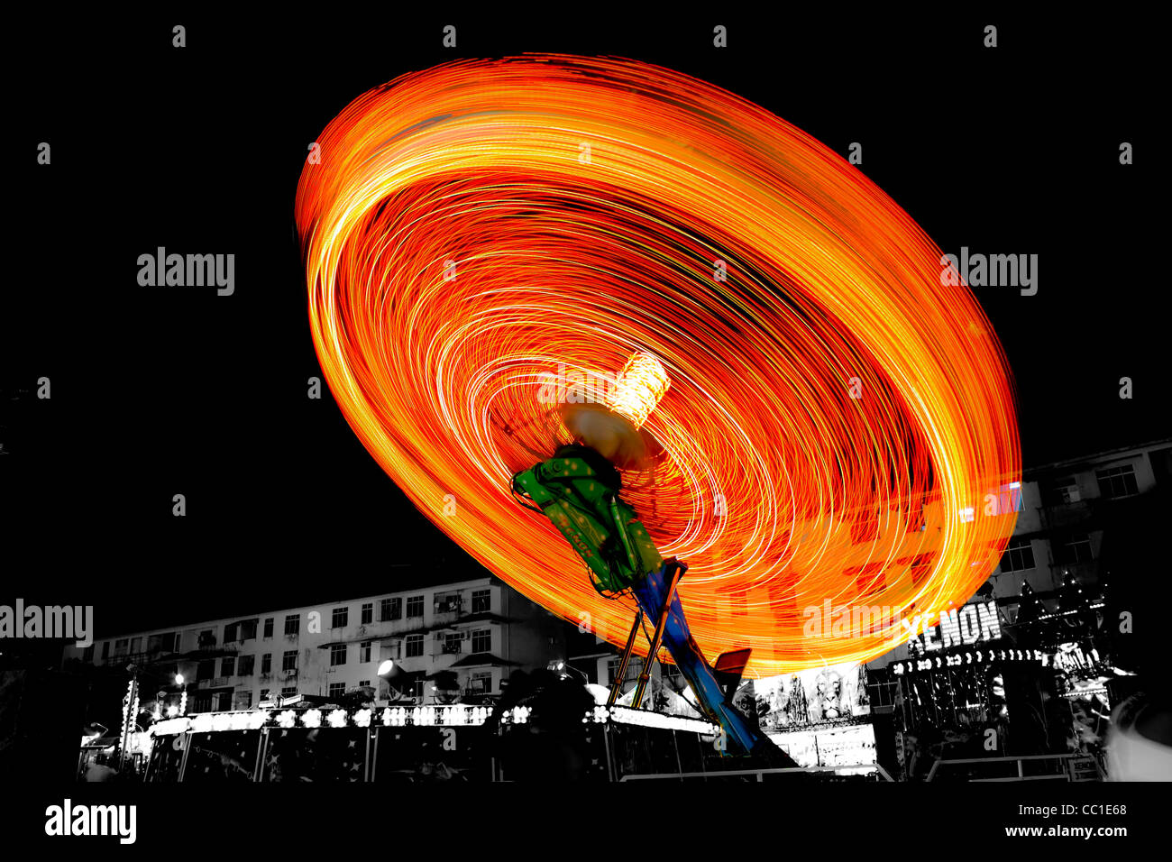 An UFO spinning in fun fair theme park Stock Photo - Alamy