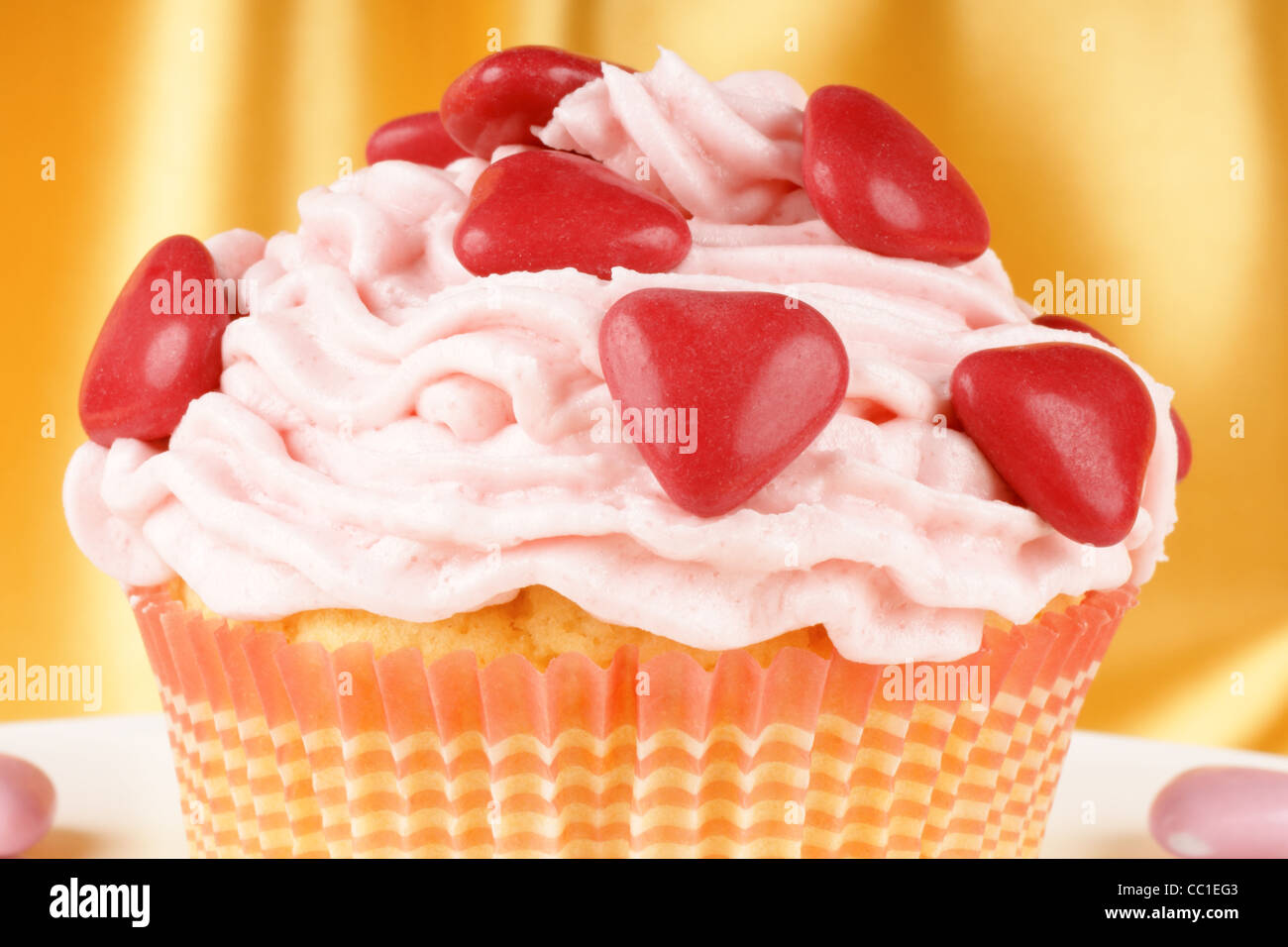 Valentine's Day cupcake decorated with red sugar-coated chocolates ...