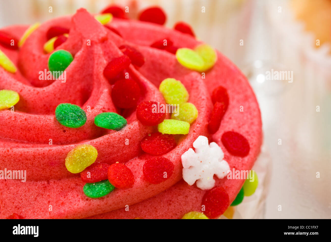 A Single Red Cupcake with Sprinkles Stock Photo - Alamy