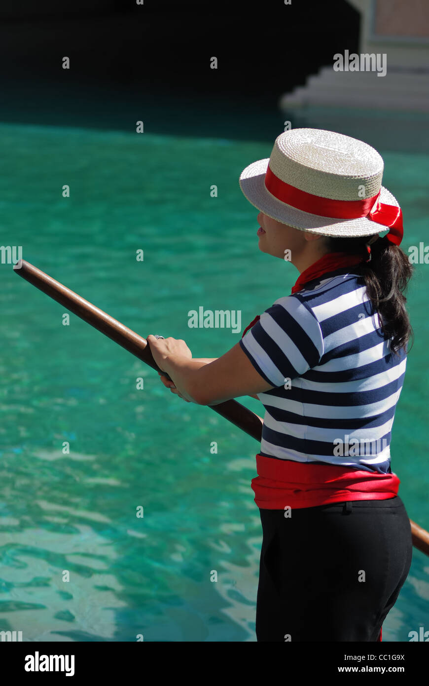 Girl manoeuvring punt at the themed Venetian Hotel, Las Vegas. USA ...