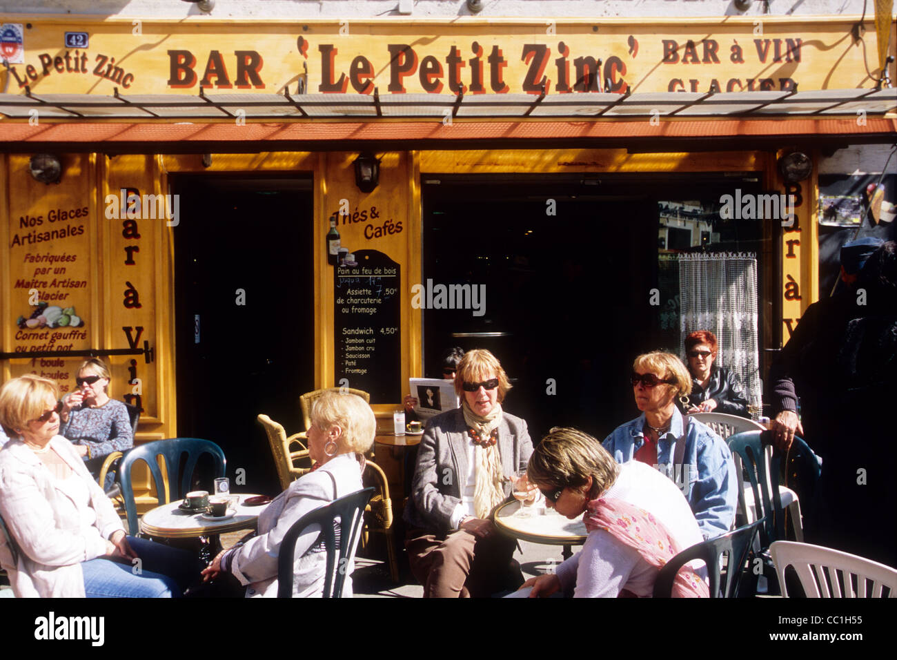 People having drink in a typical French café of Provence Stock Photo ...