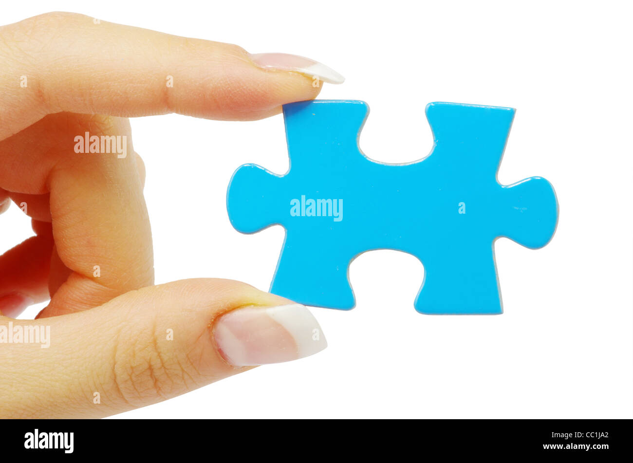 hand holding a puzzle piece Stock Photo - Alamy