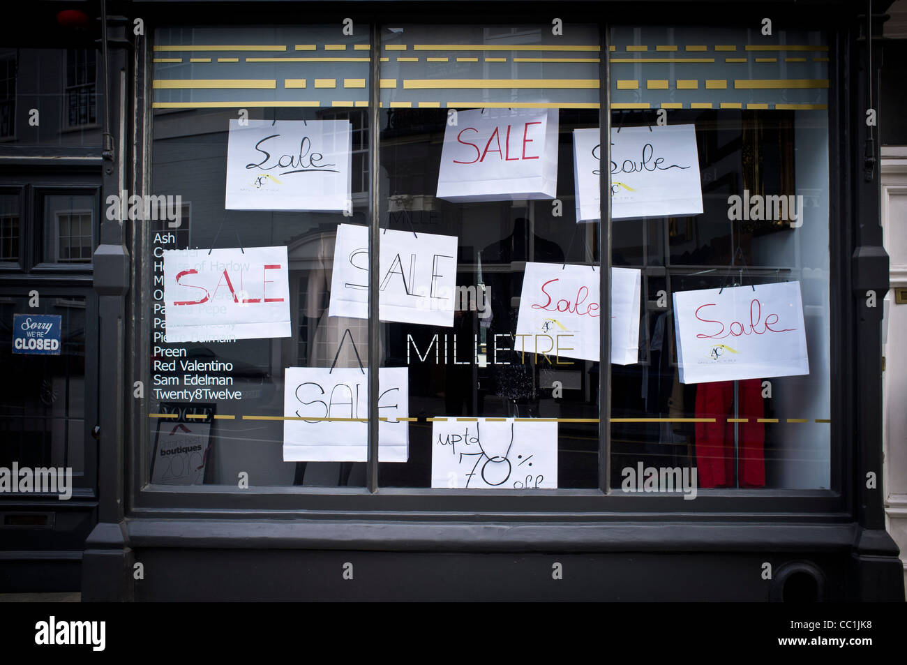 Sale signs in Shop Window Stock Photo - Alamy