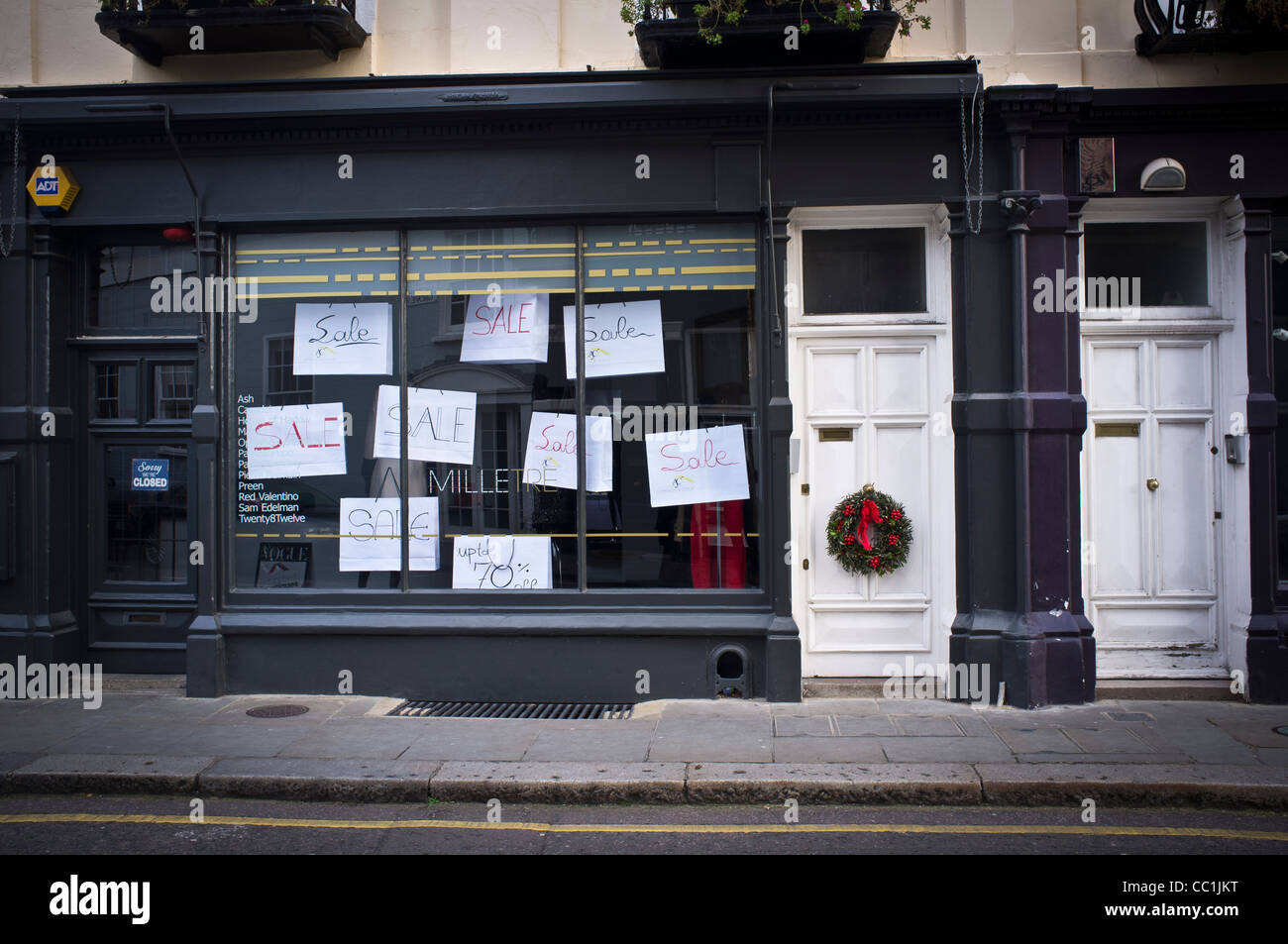 Sale signs in Shop Window Stock Photo - Alamy