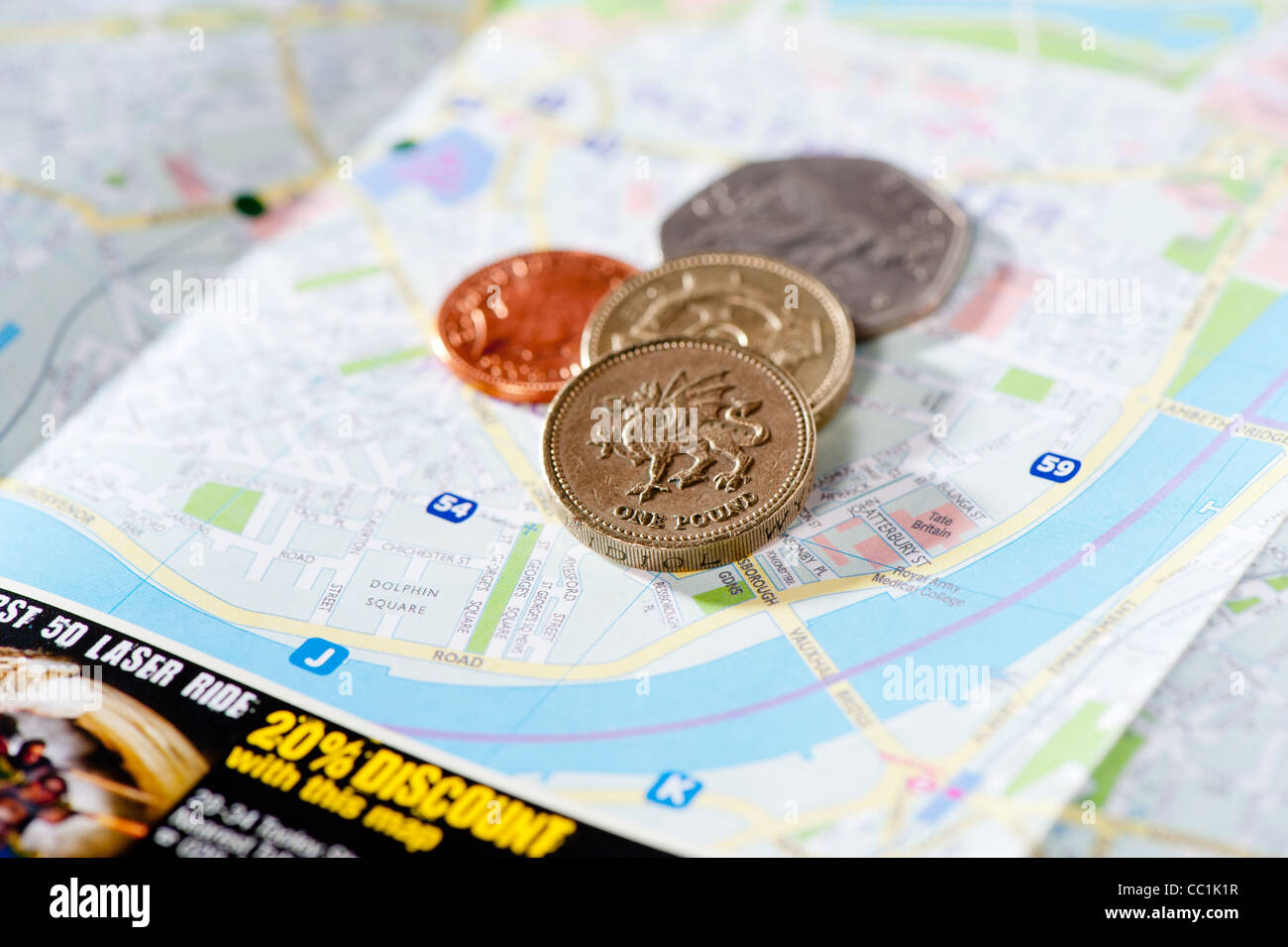 Pocket change on london street map Stock Photo - Alamy