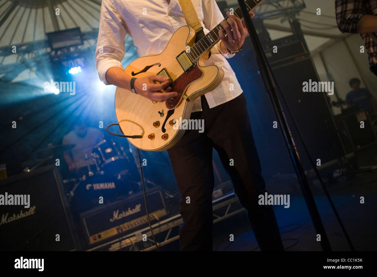 A guitarist plays on stage at the Standon Calling Festival in ...