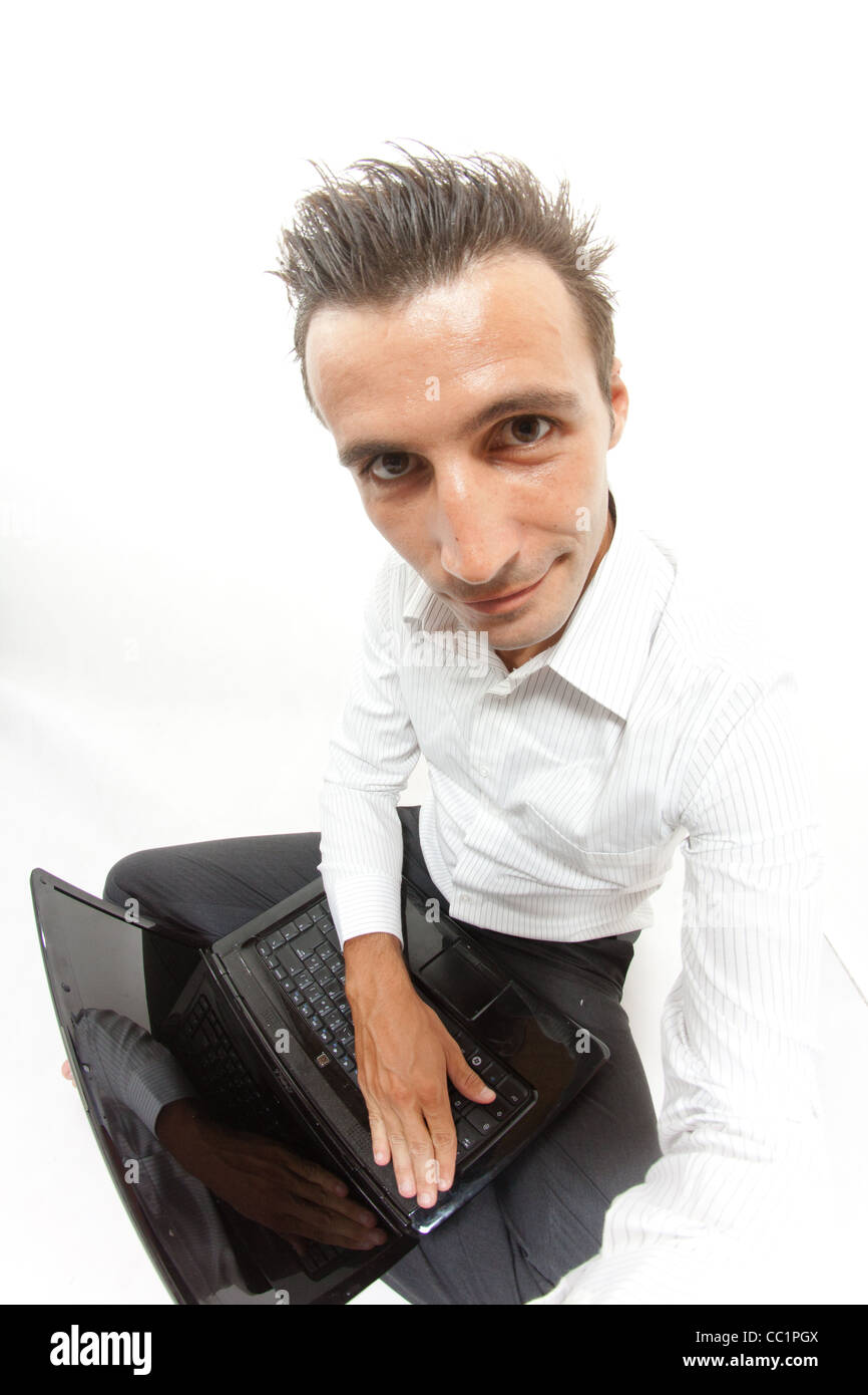 Funny face of a man with a computer Stock Photo - Alamy