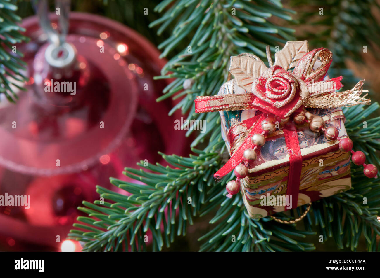 Close up of a small gift on a Christmas tree Stock Photo - Alamy