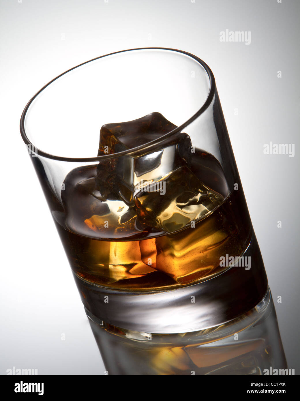 whisky and ice cube, a studio shot Stock Photo - Alamy
