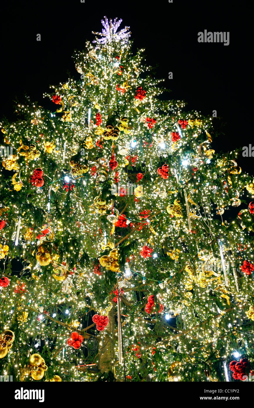 White electric christmas tree on black background Stock Photo - Alamy