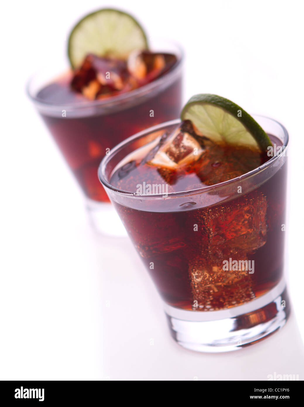 cocktail with lime and cola on white background Stock Photo - Alamy