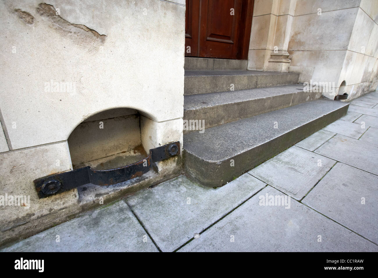 antique boot scraper built into the wall of a historic old office ...